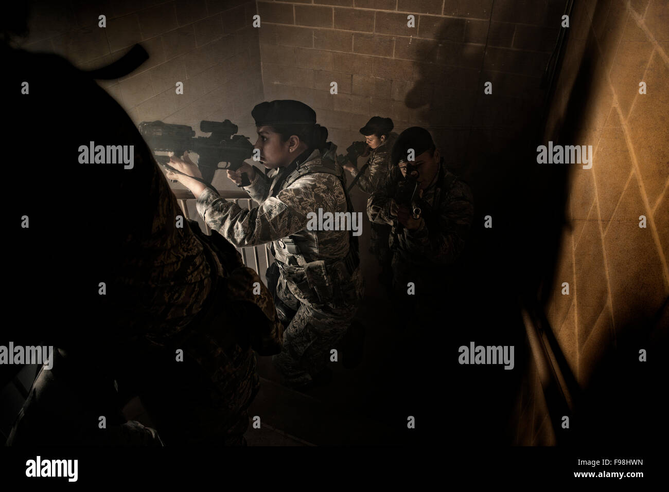 An Air Force Security Forces squad clear the stairwell of a training ...