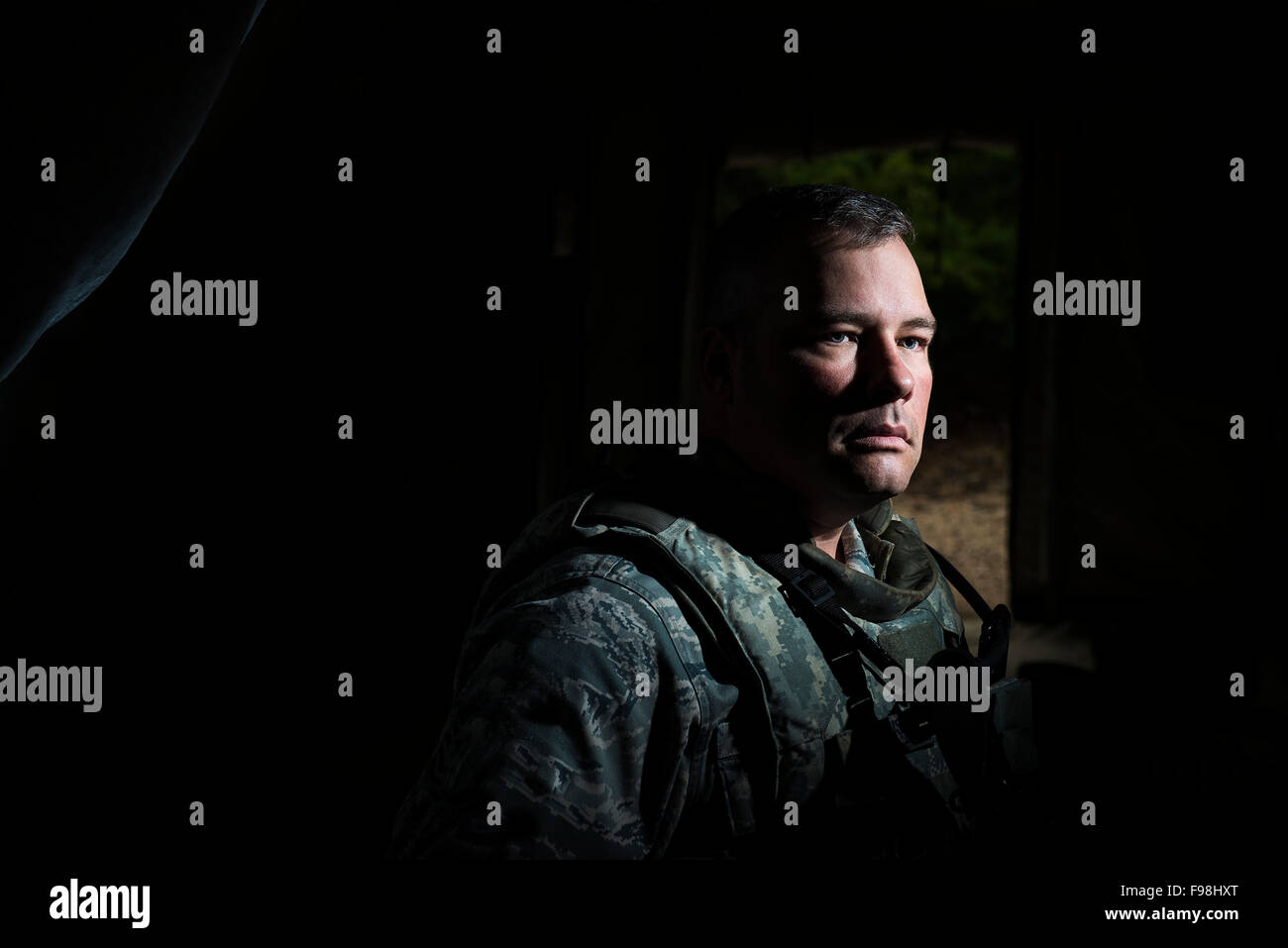 An Air Force Security Forces member prepares a mission briefing in the ...