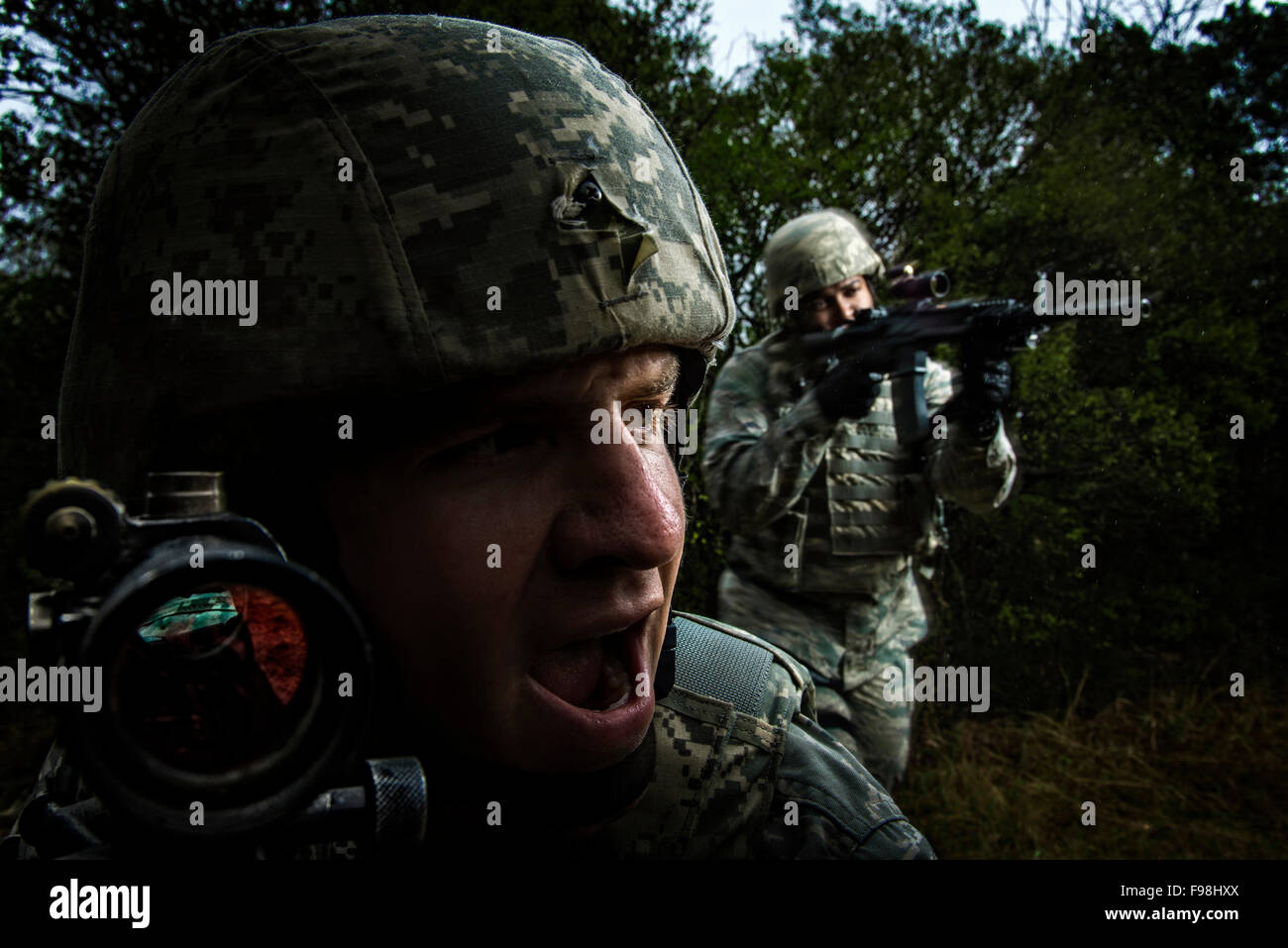 Air Force Security Forces members bound toward the enemy during ...