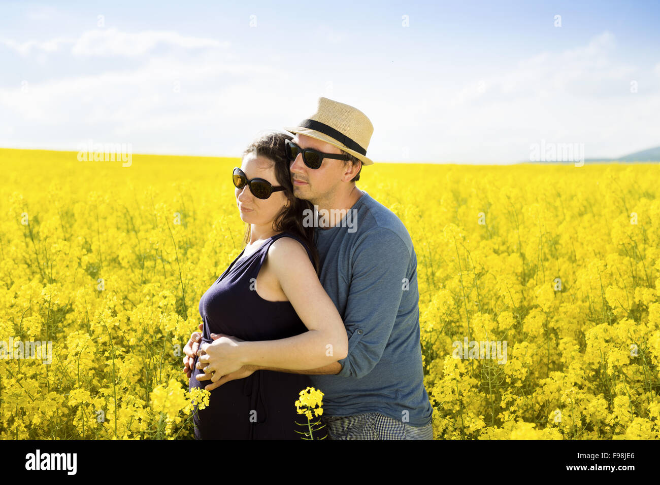 Spring outdoor portrait of young pregnant couple Stock Photo - Alamy