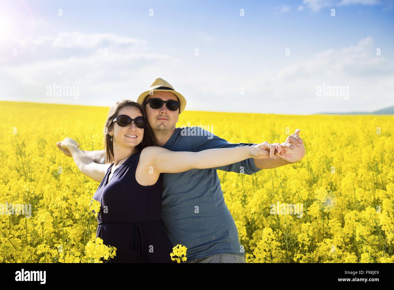 Spring outdoor portrait of young pregnant couple Stock Photo - Alamy