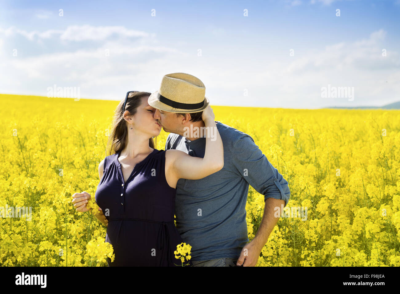 Spring outdoor portrait of young pregnant couple Stock Photo - Alamy
