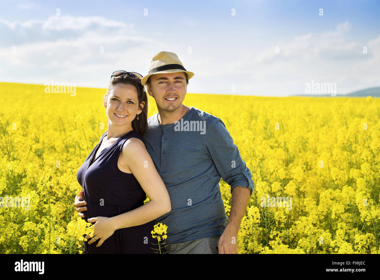 Spring outdoor portrait of young pregnant couple Stock Photo - Alamy