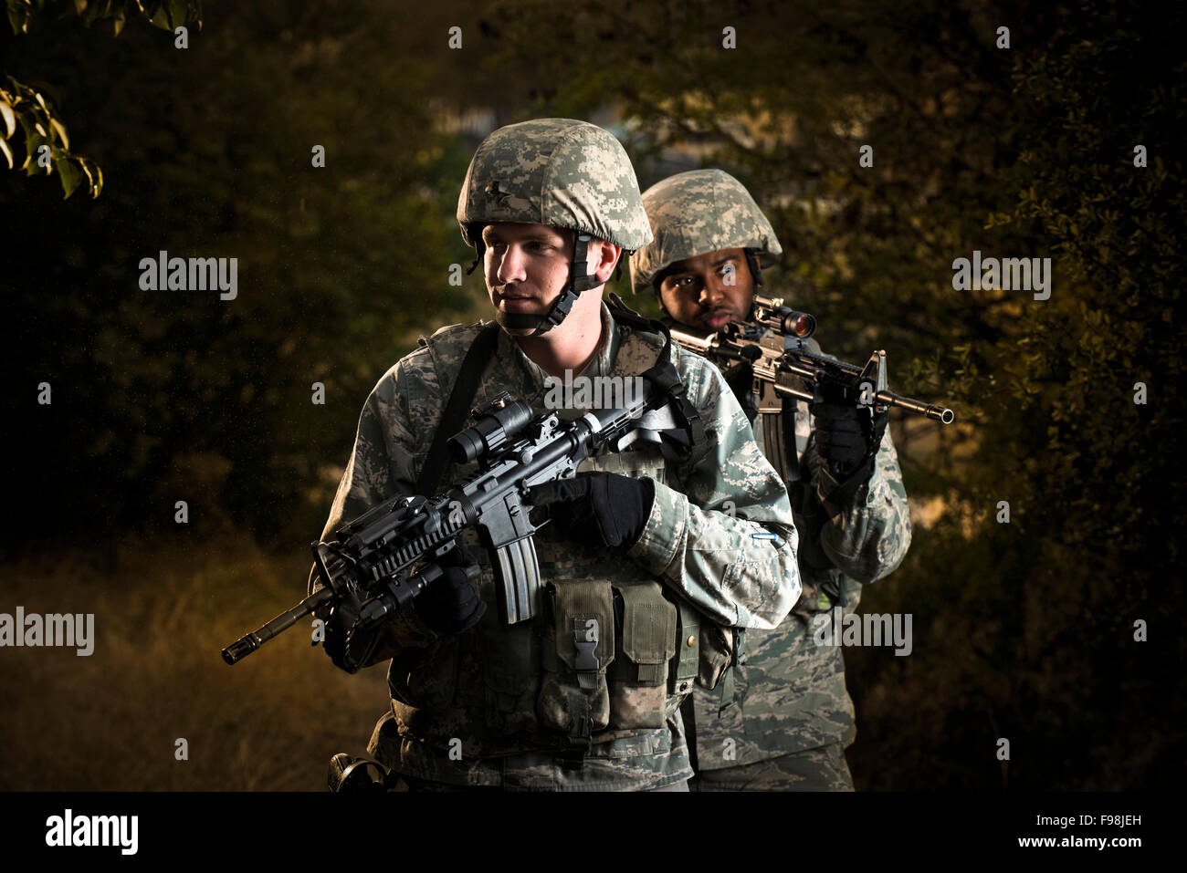 A two-man Air Force Security Forces team patrol the compound perimeter ...