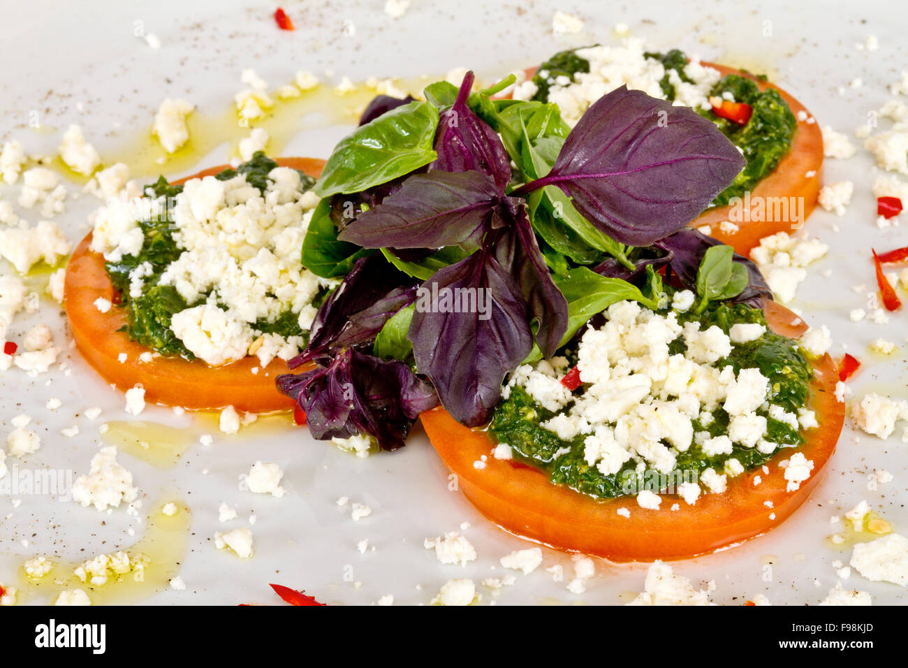 appetizer with tomato,cheese and pesto Stock Photo - Alamy