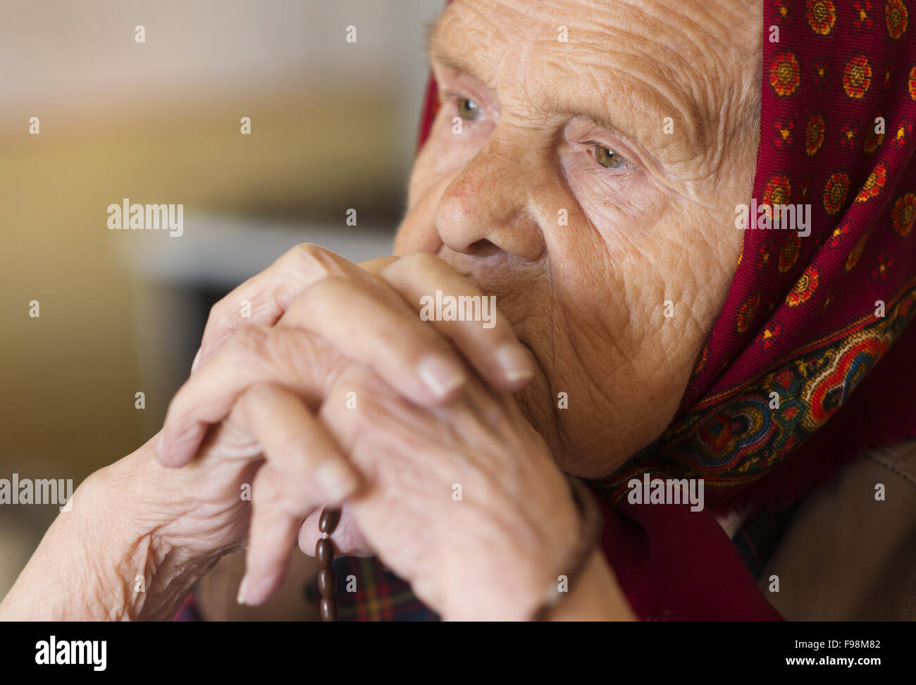 Old woman in head scarf hi-res stock photography and images - Alamy