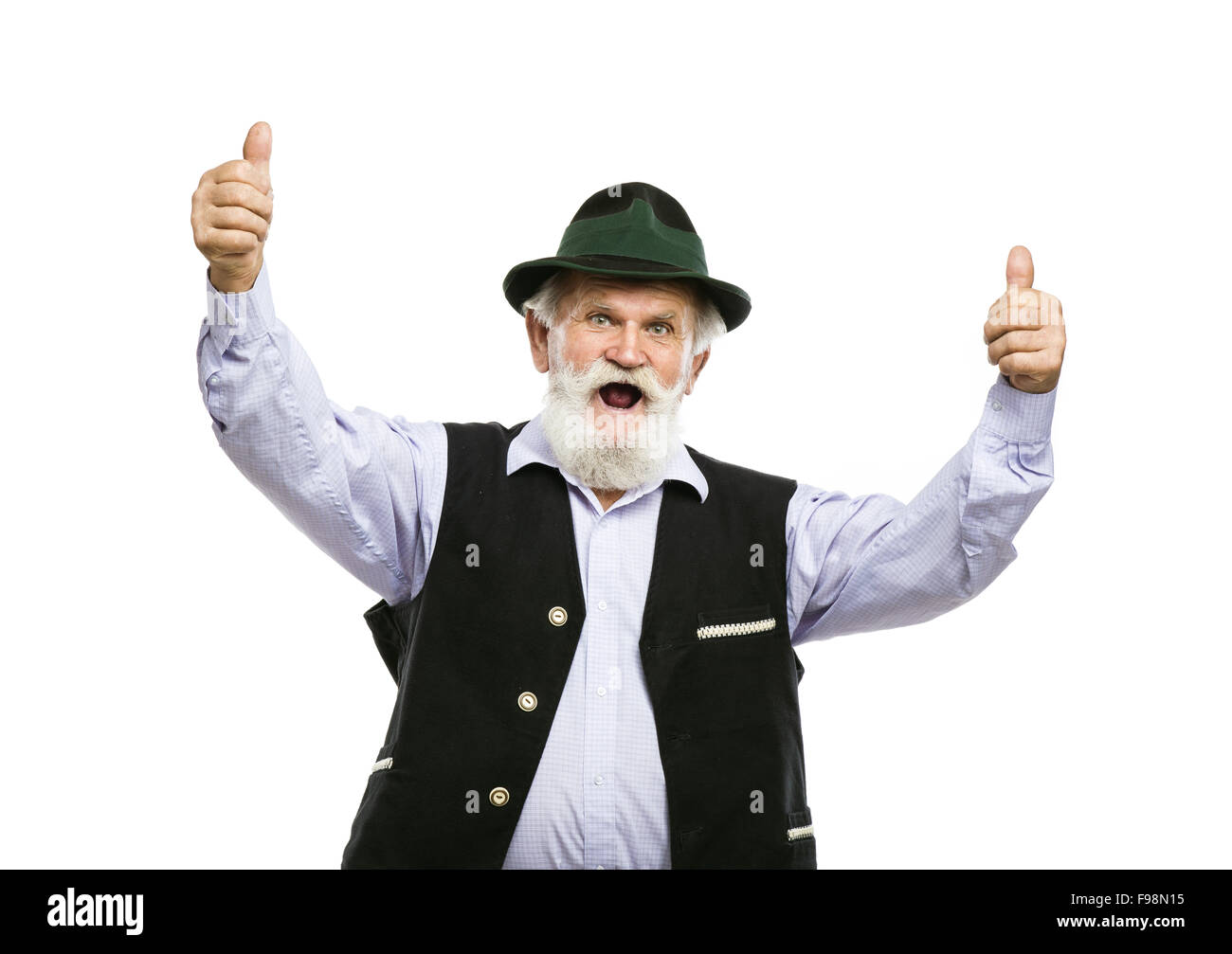 Portrait of old bearded bavarian man in traditional hat with thumbs up ...