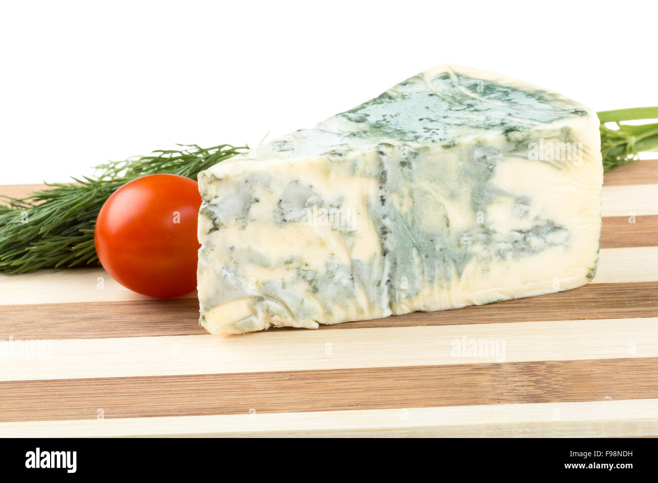 Wedge of soft blue cheese, isolated on white Stock Photo - Alamy