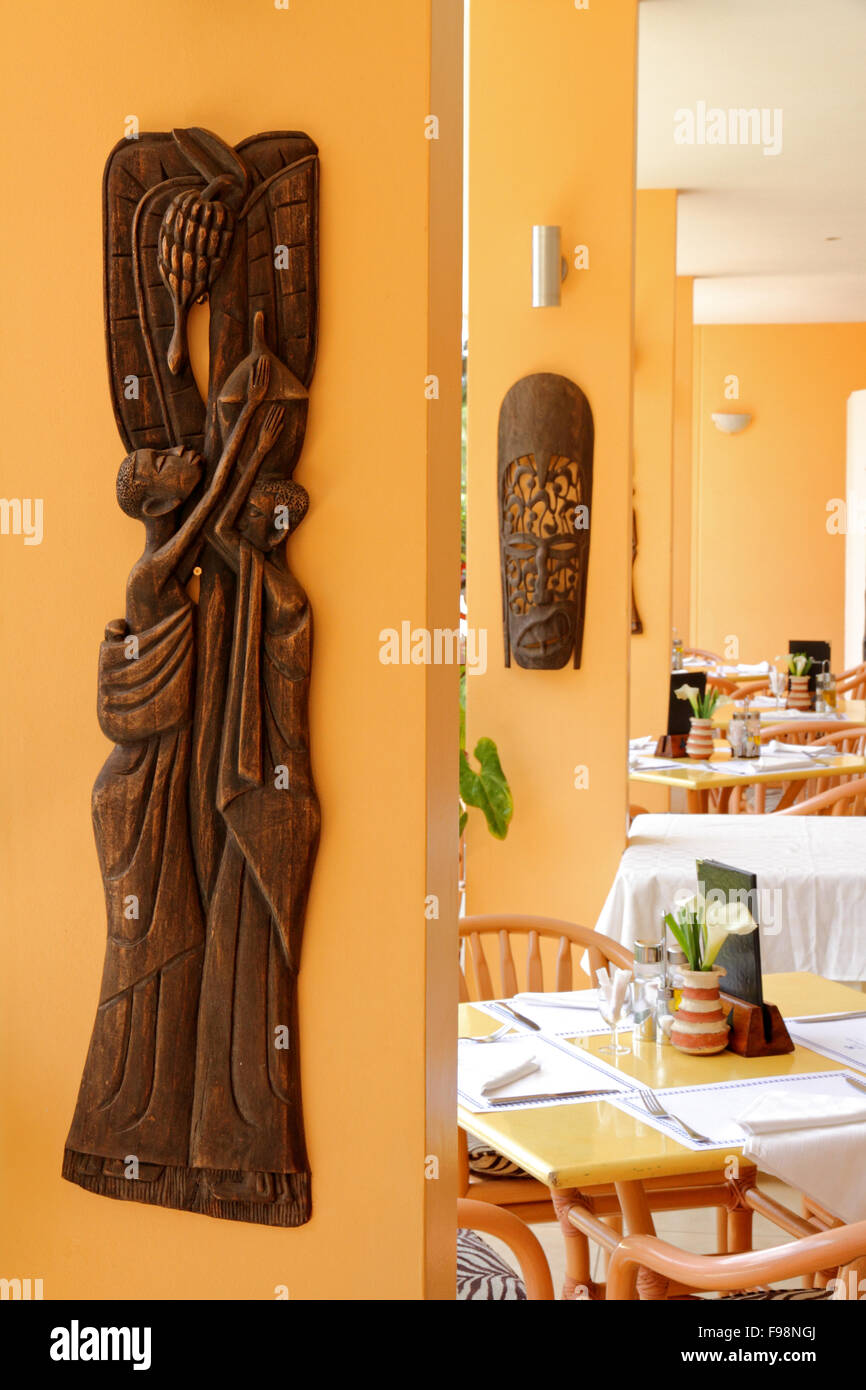 A dining area set up for customers in an african themed restaurant ...