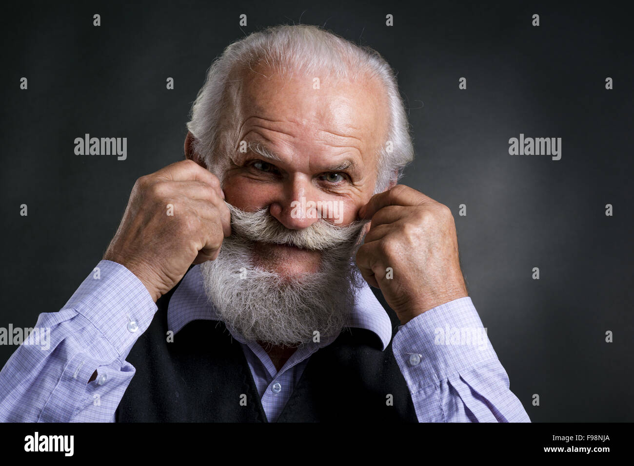 Portrait of old bearded man, posing in studio on black background Stock ...