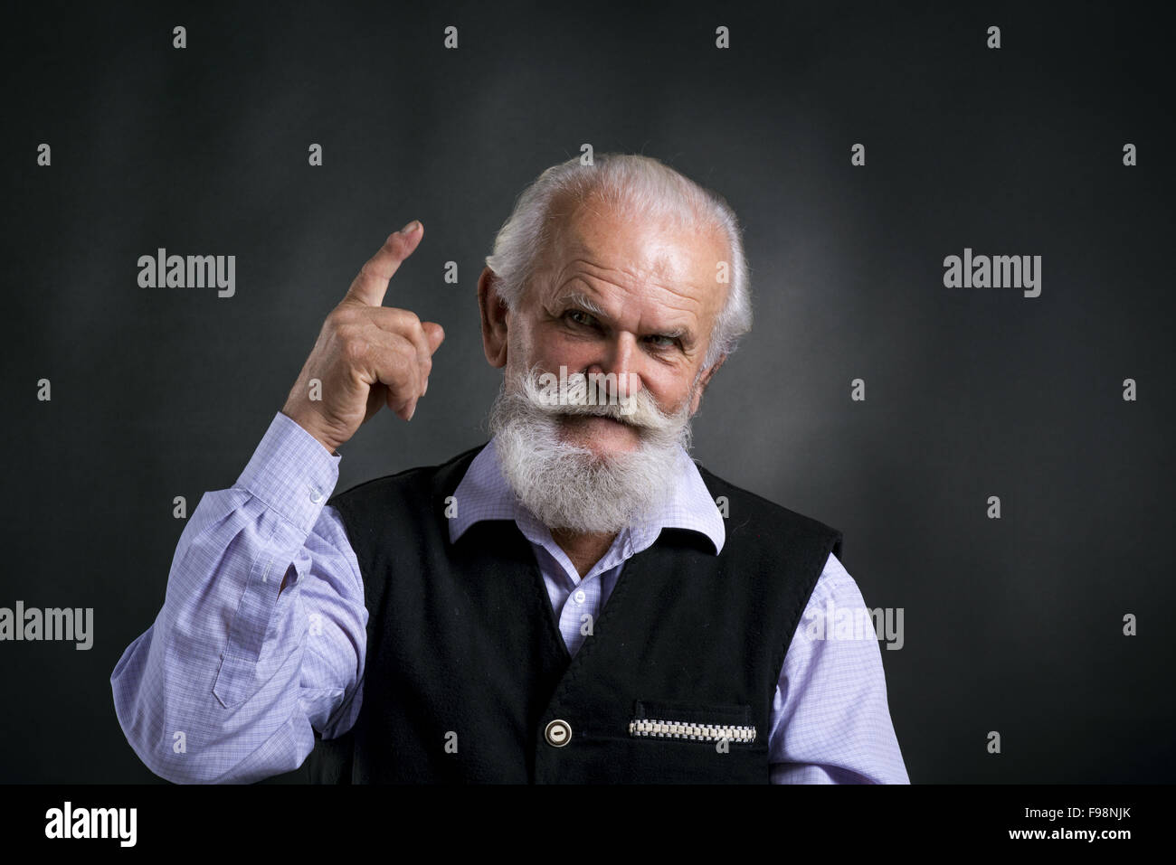 Portrait of old bearded man, posing in studio on black background Stock ...