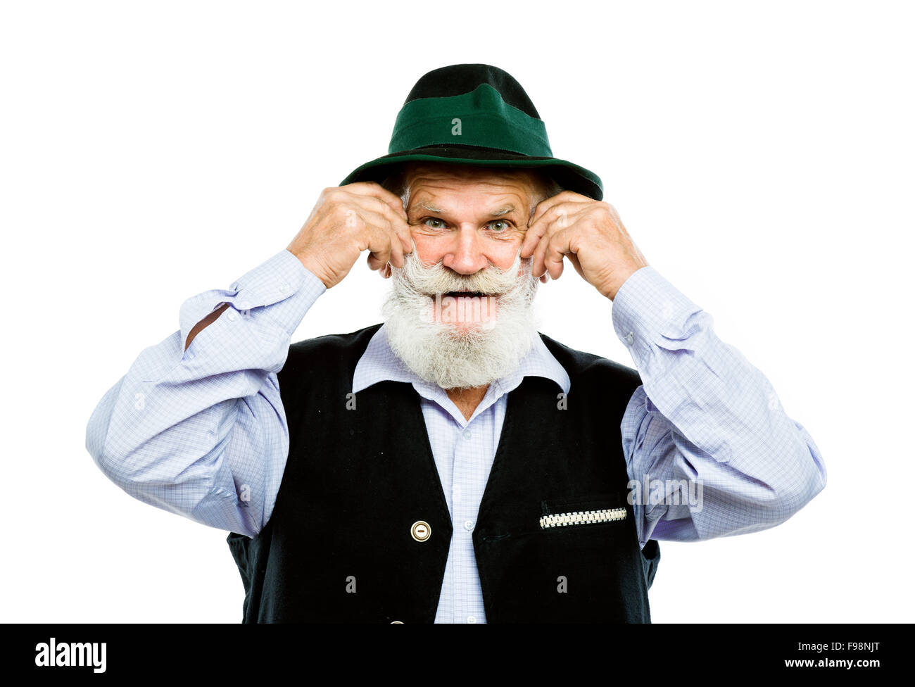 Portrait of old bearded bavarian man in traditional felt hat, posing in ...
