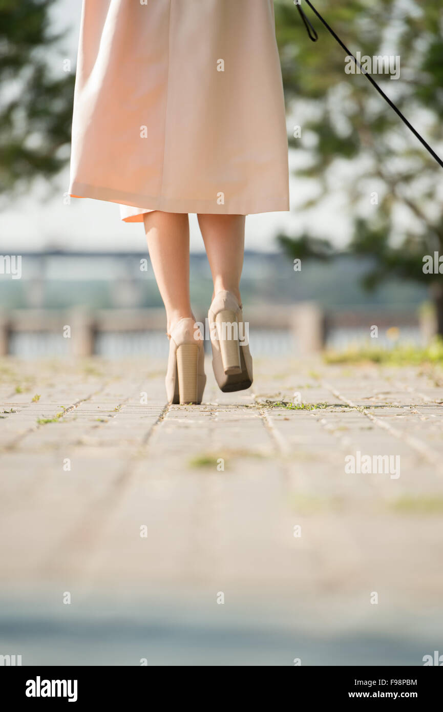 Rear view woman legs skirt hi-res stock photography and images - Alamy