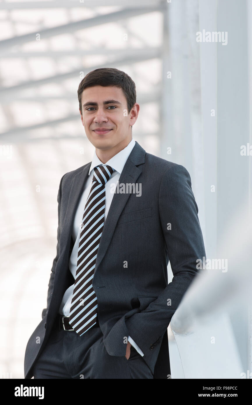 Young smiling handsome businessman hi-res stock photography and images ...