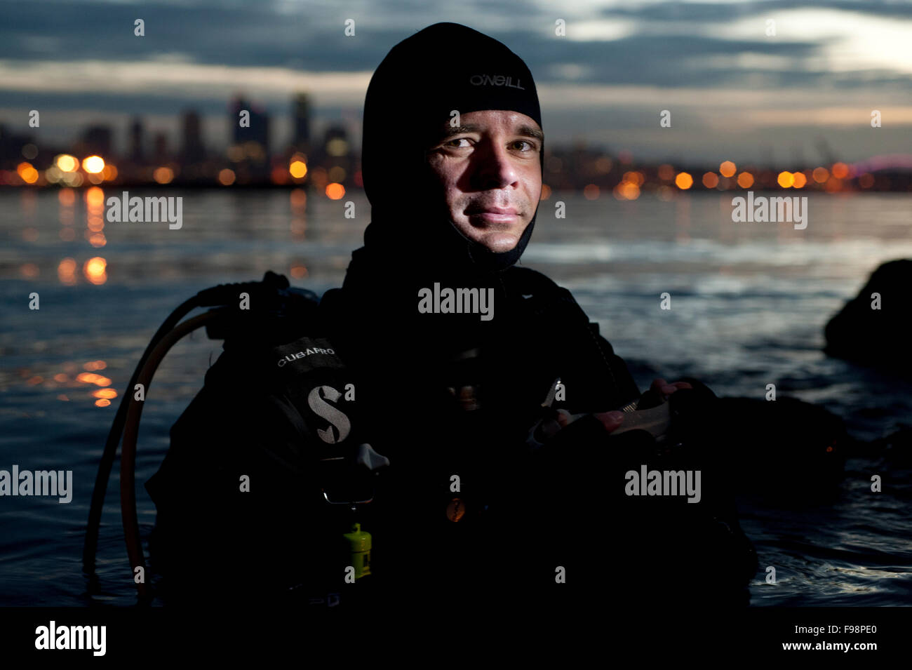 Scuba diver portrait with city background Stock Photo - Alamy