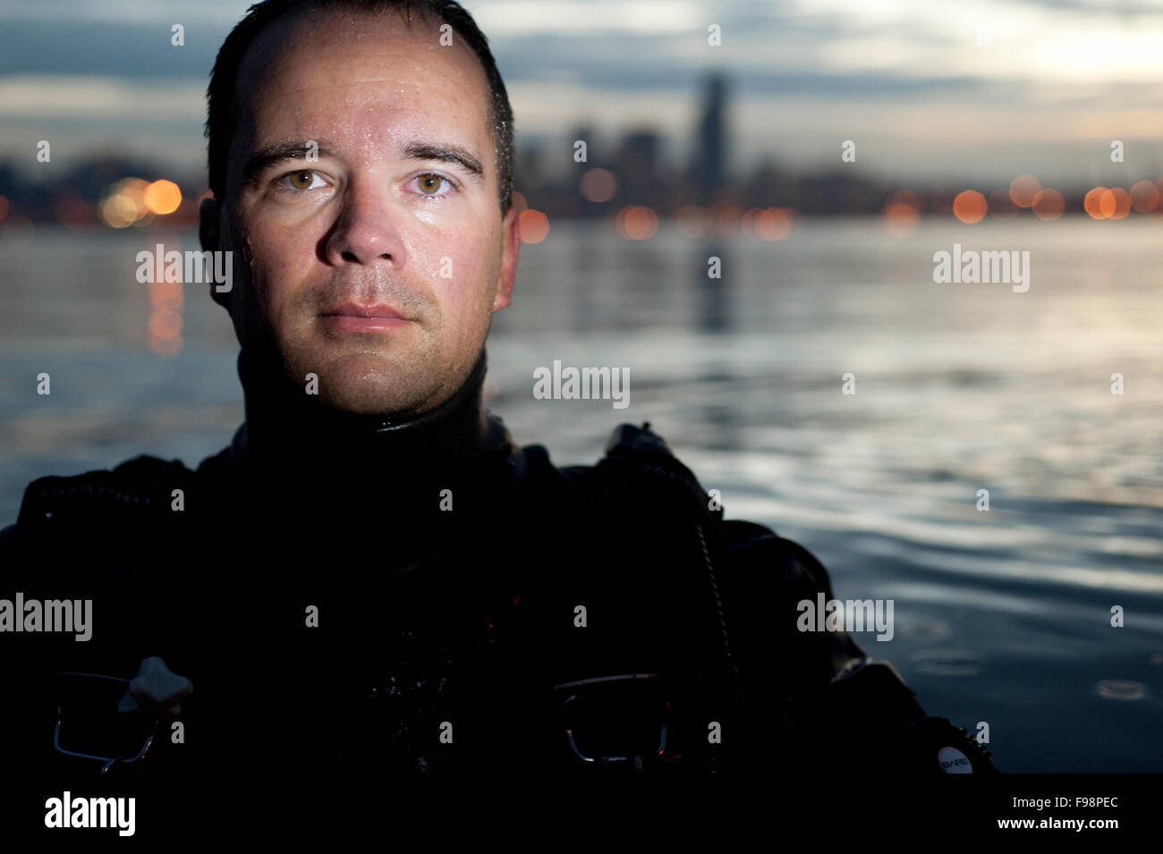 Scuba diver portrait with city background Stock Photo - Alamy