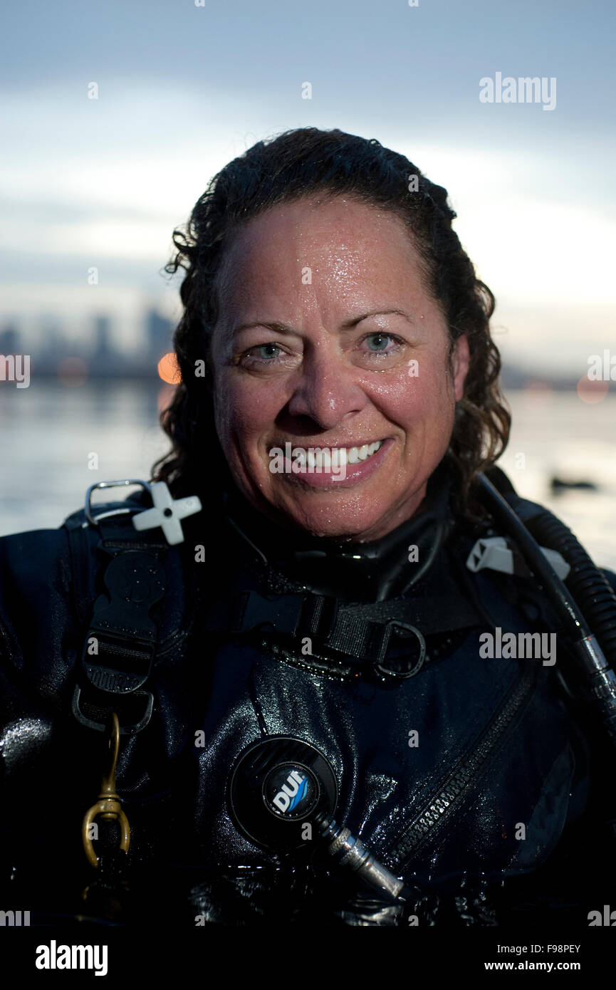 Scuba diver portrait with city background Stock Photo - Alamy