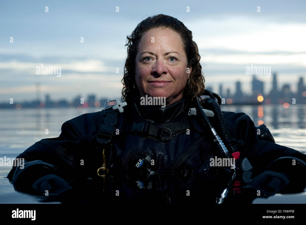 Scuba diver portrait with city background Stock Photo - Alamy