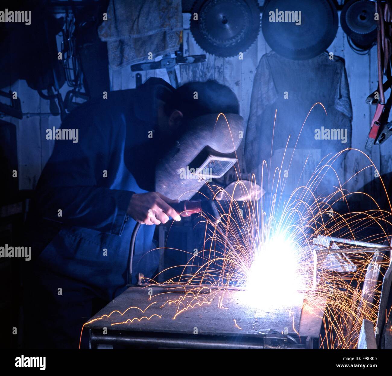 Man welding wearing protective clothing in a workshop, Aldridge, West ...