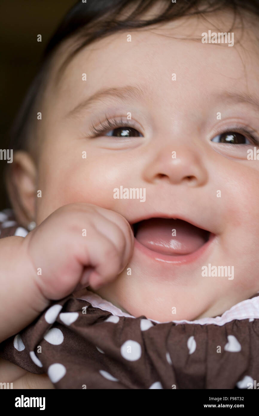 Portrait of a brown haired baby girl in her family's home in California ...