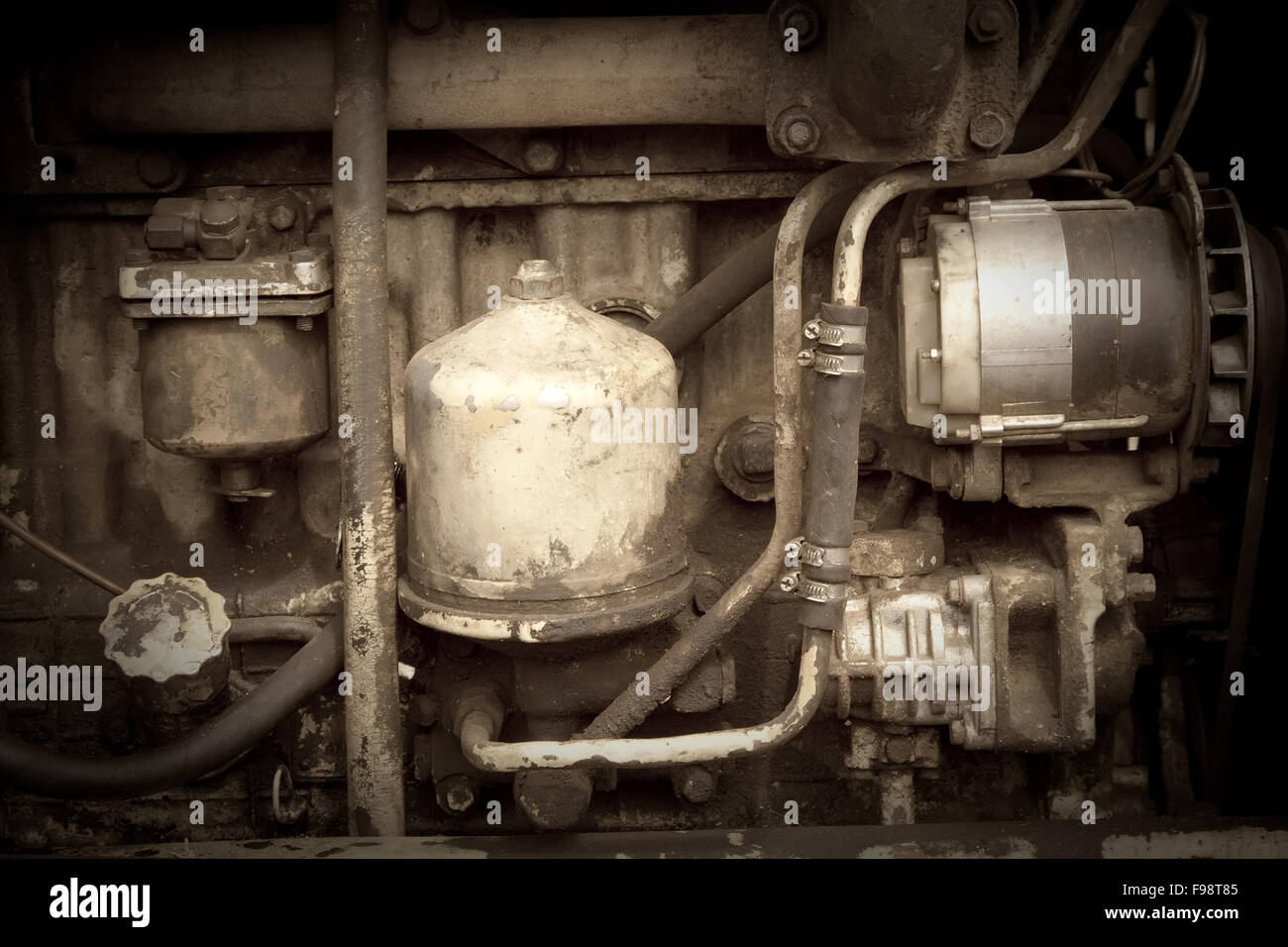 Vintage photo of battered old farm tractor engine Stock Photo - Alamy