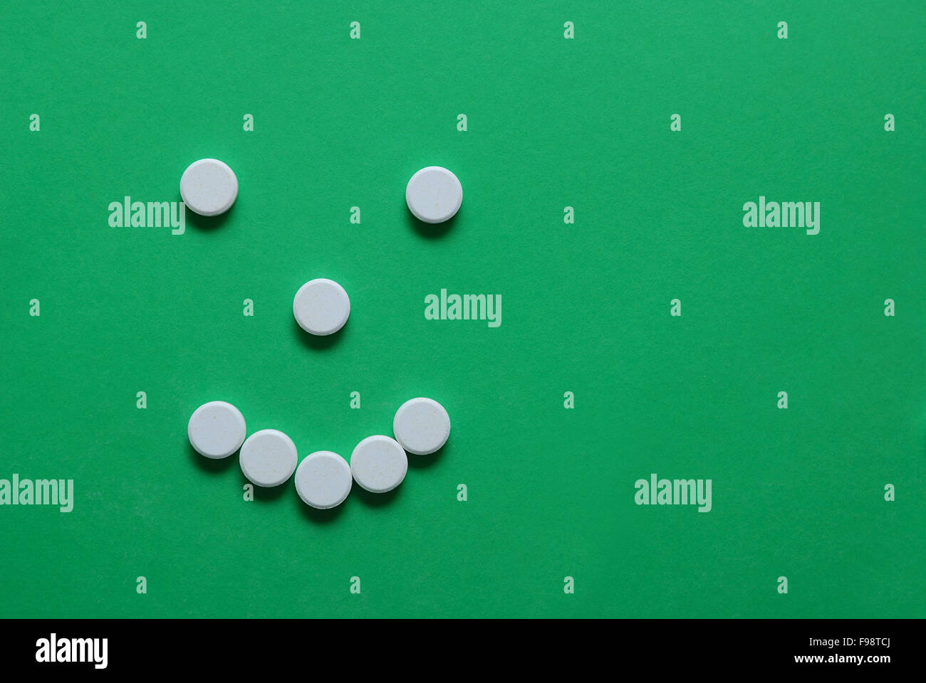 smiley simbol with white pills Stock Photo - Alamy