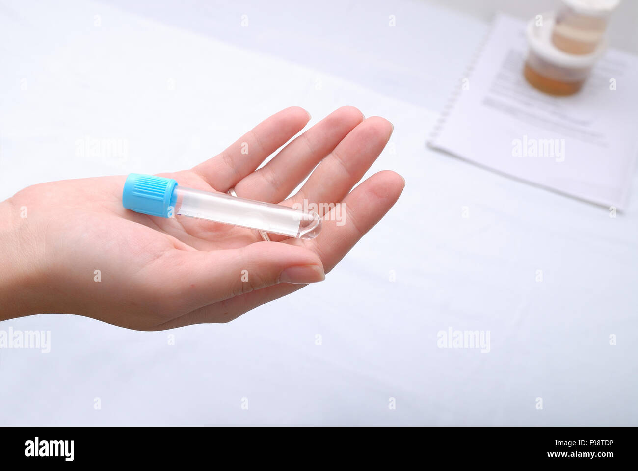 test tube in woman hand Stock Photo - Alamy