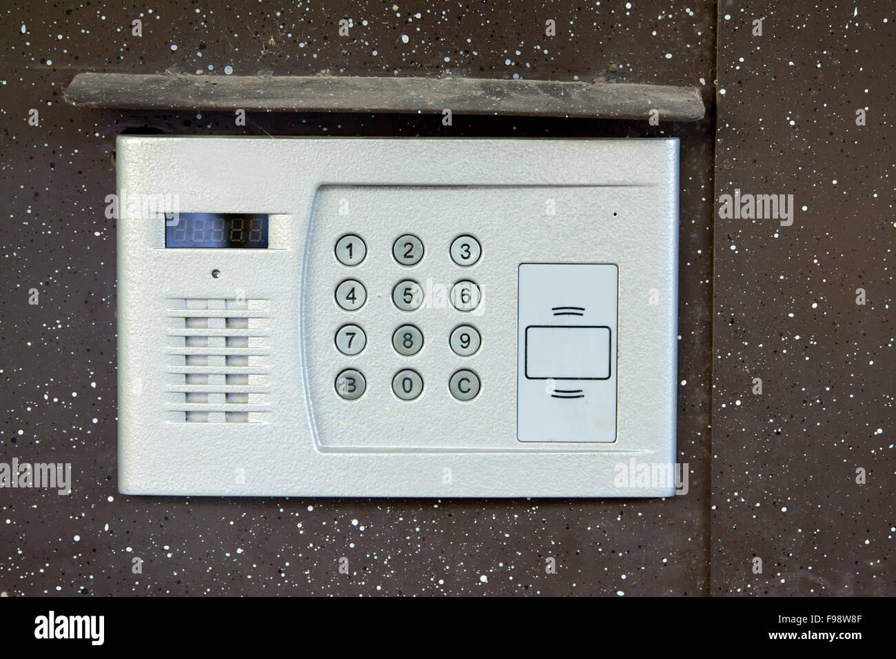 Close-up of building intercom in steel door Stock Photo - Alamy