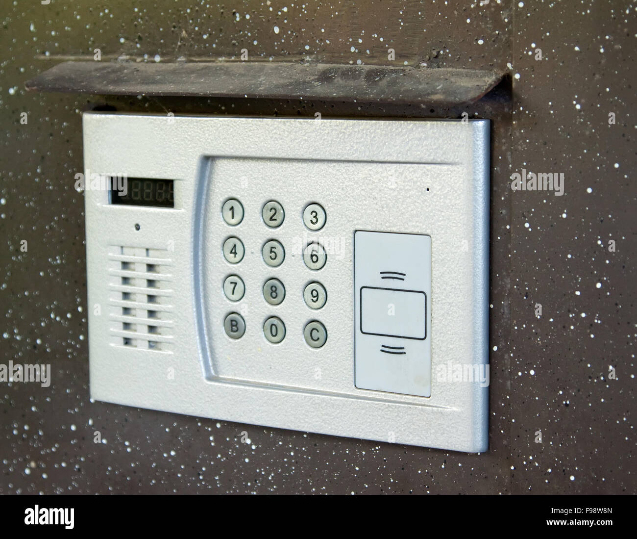 Close-up of building intercom in steel door Stock Photo - Alamy