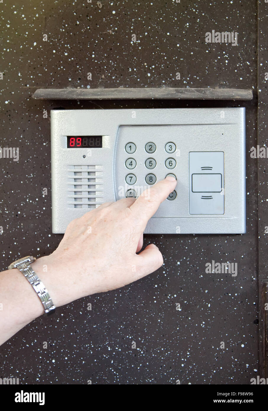 Close-up of uses intercom in steel door Stock Photo - Alamy