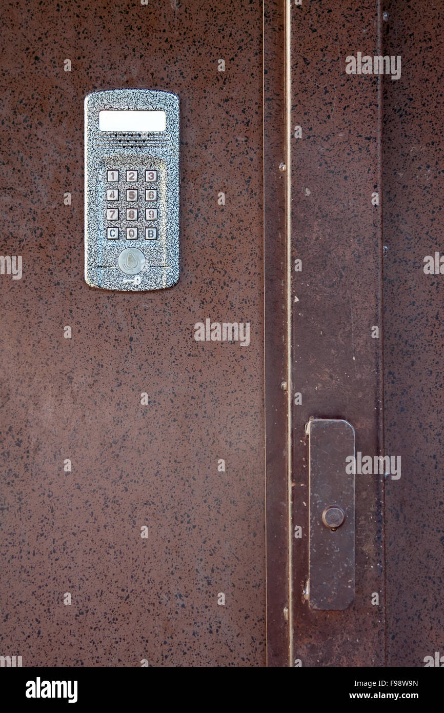 Close-up of building intercom in steel door Stock Photo - Alamy