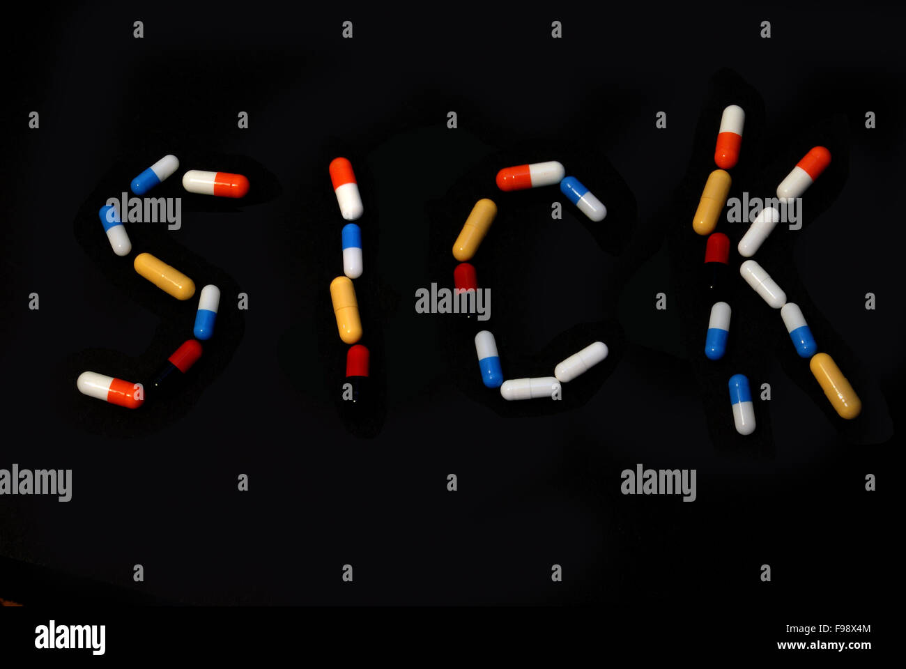 word 'sick' writen with pils on black background Stock Photo - Alamy