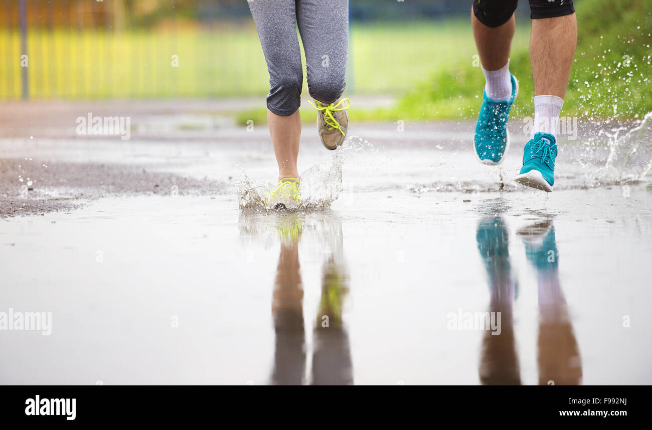 Athletic man running in rainy hi-res stock photography and images - Alamy