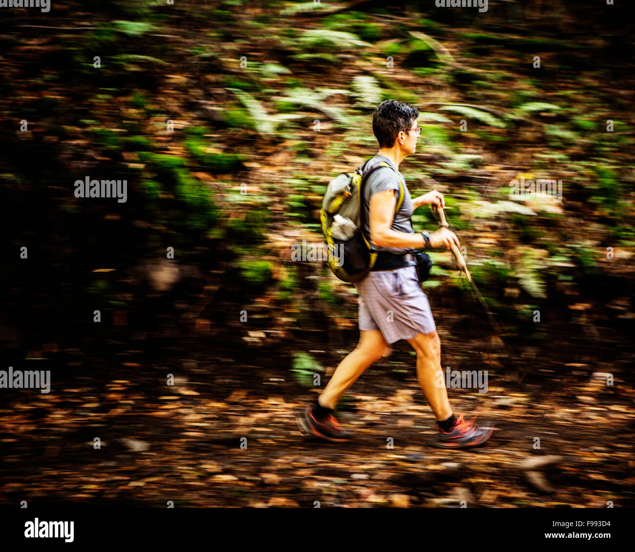 Side view of a woman hiking Stock Photo - Alamy
