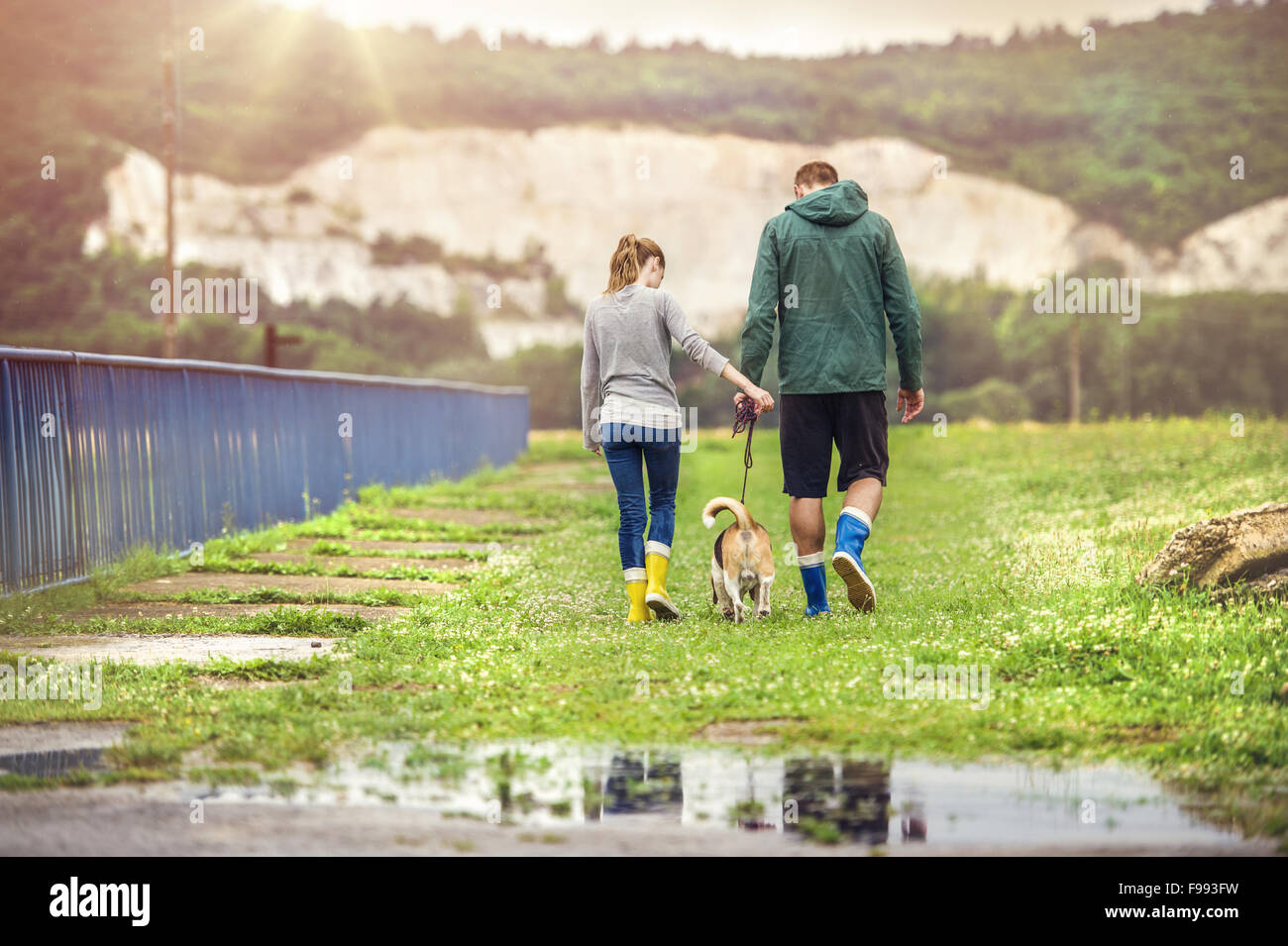 Couple dog walk summer hi-res stock photography and images - Alamy