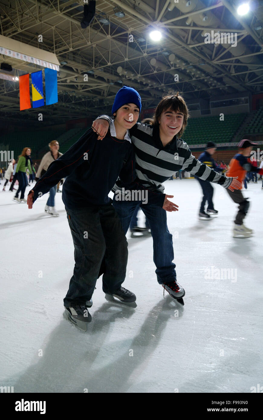 Friends enjoying ice skating Stock Photo - Alamy