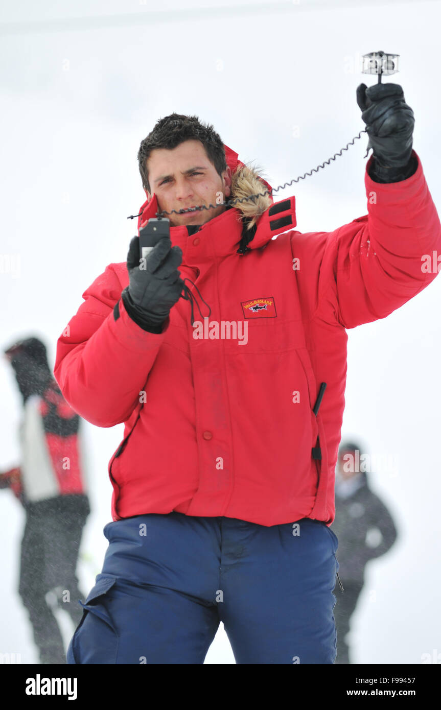 young weather meteo man measure wind speed at winter season Stock Photo ...