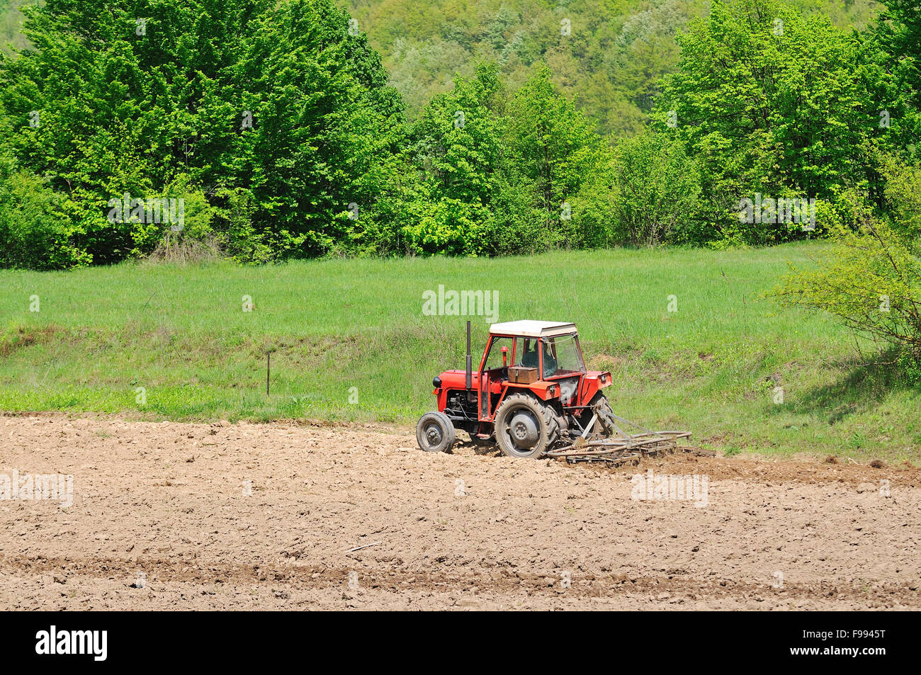 tractor trails with ground and grass background representing ...