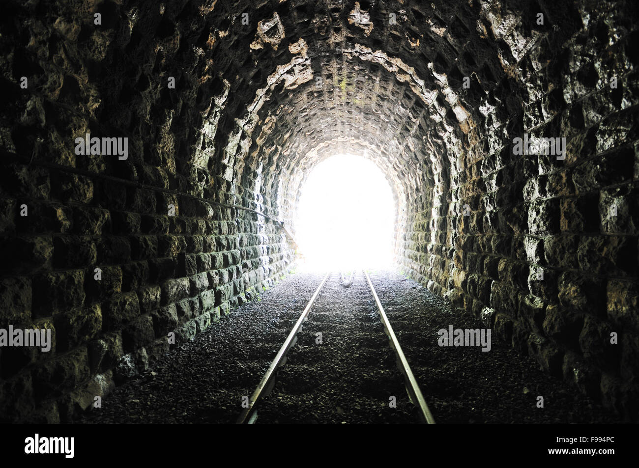 light on end of train tunnel representing new life and success concept ...