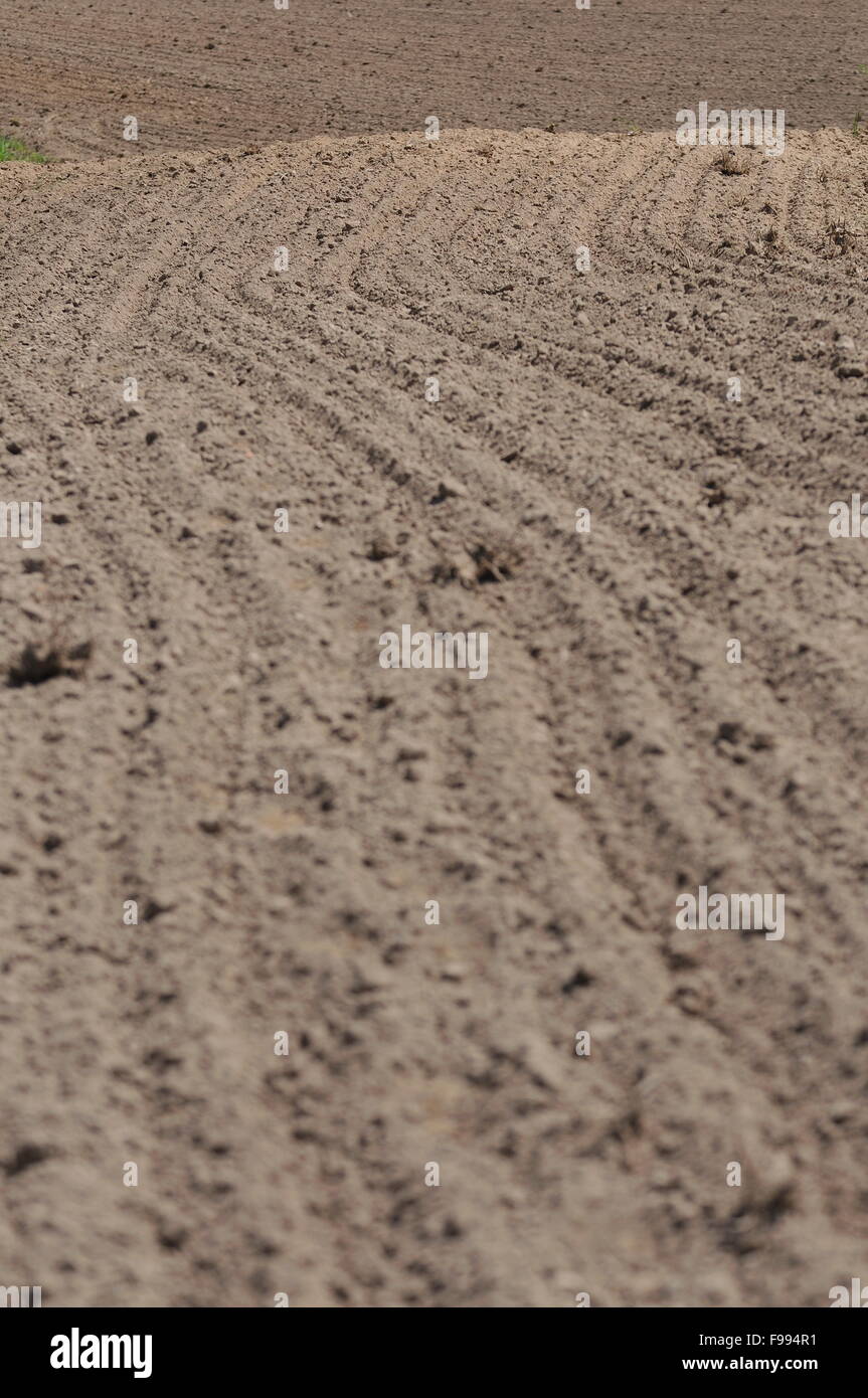 tractor trails with ground and grass background representing ...