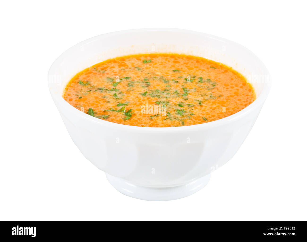 a plate of soup on a white background Stock Photo - Alamy
