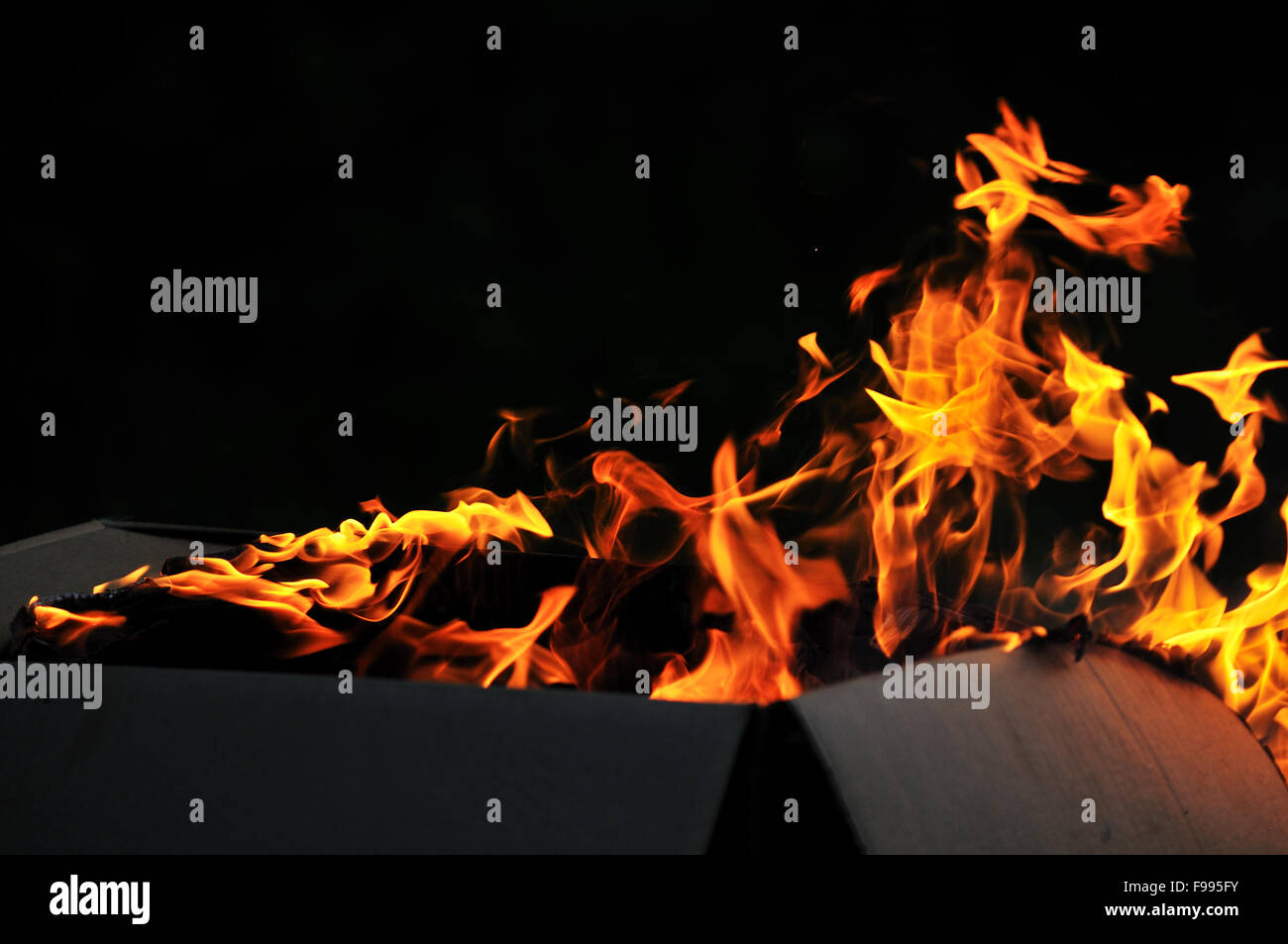 wild fire flames burn hot with black background Stock Photo - Alamy