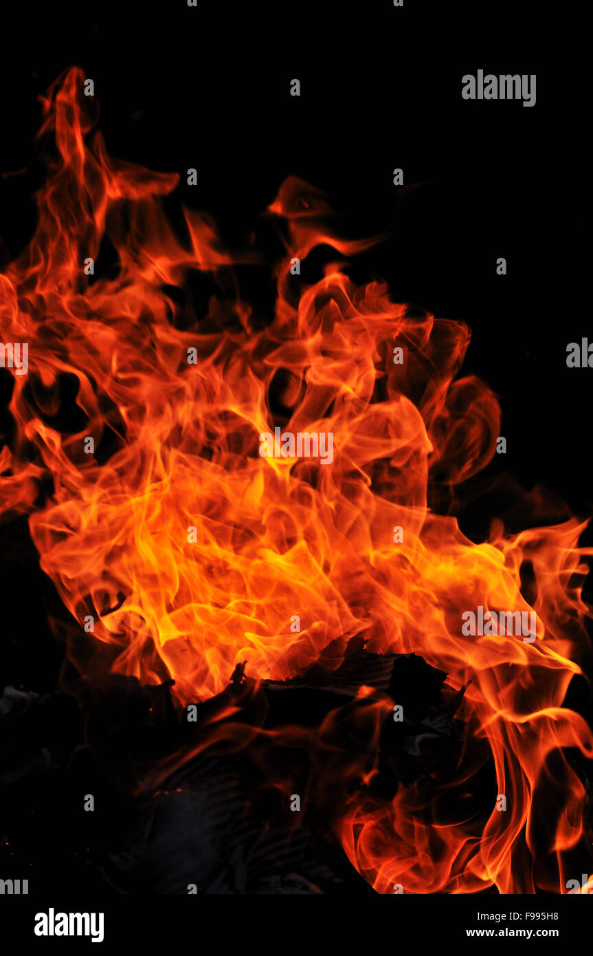 wild fire flames burn hot with black background Stock Photo - Alamy