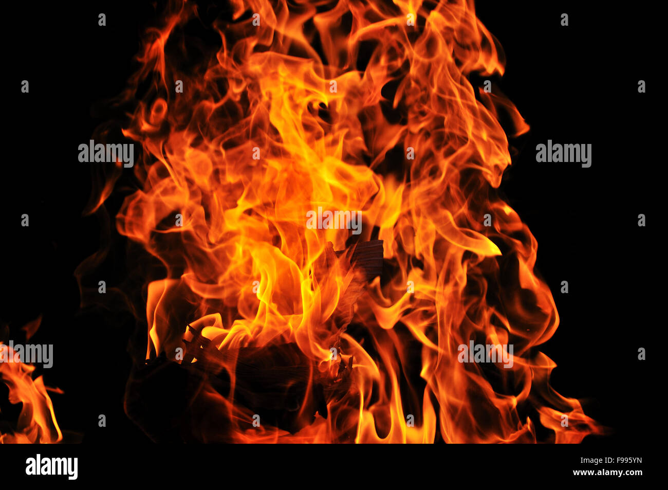 wild fire flames burn hot with black background Stock Photo - Alamy