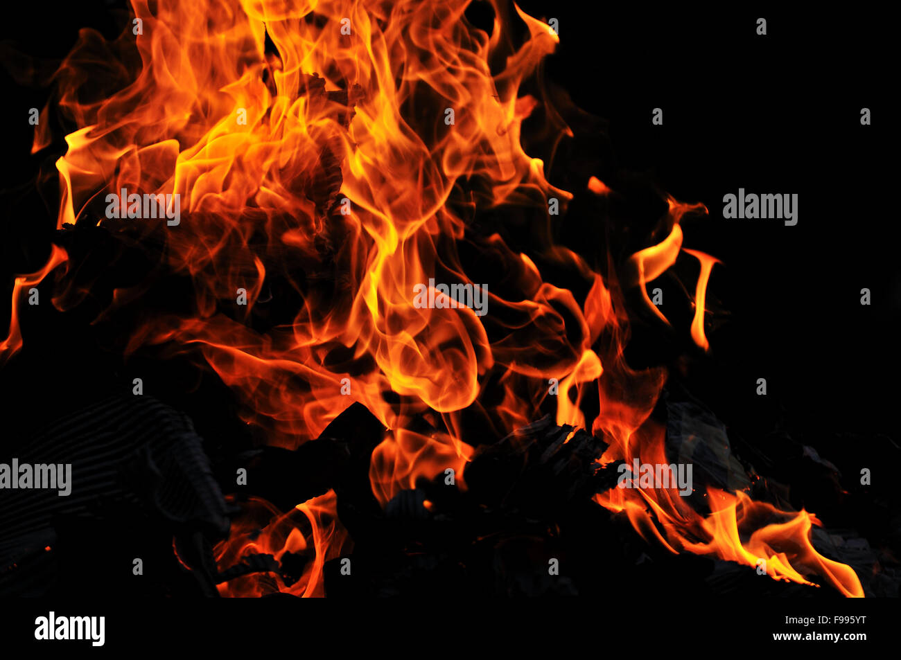 wild fire flames burn hot with black background Stock Photo - Alamy