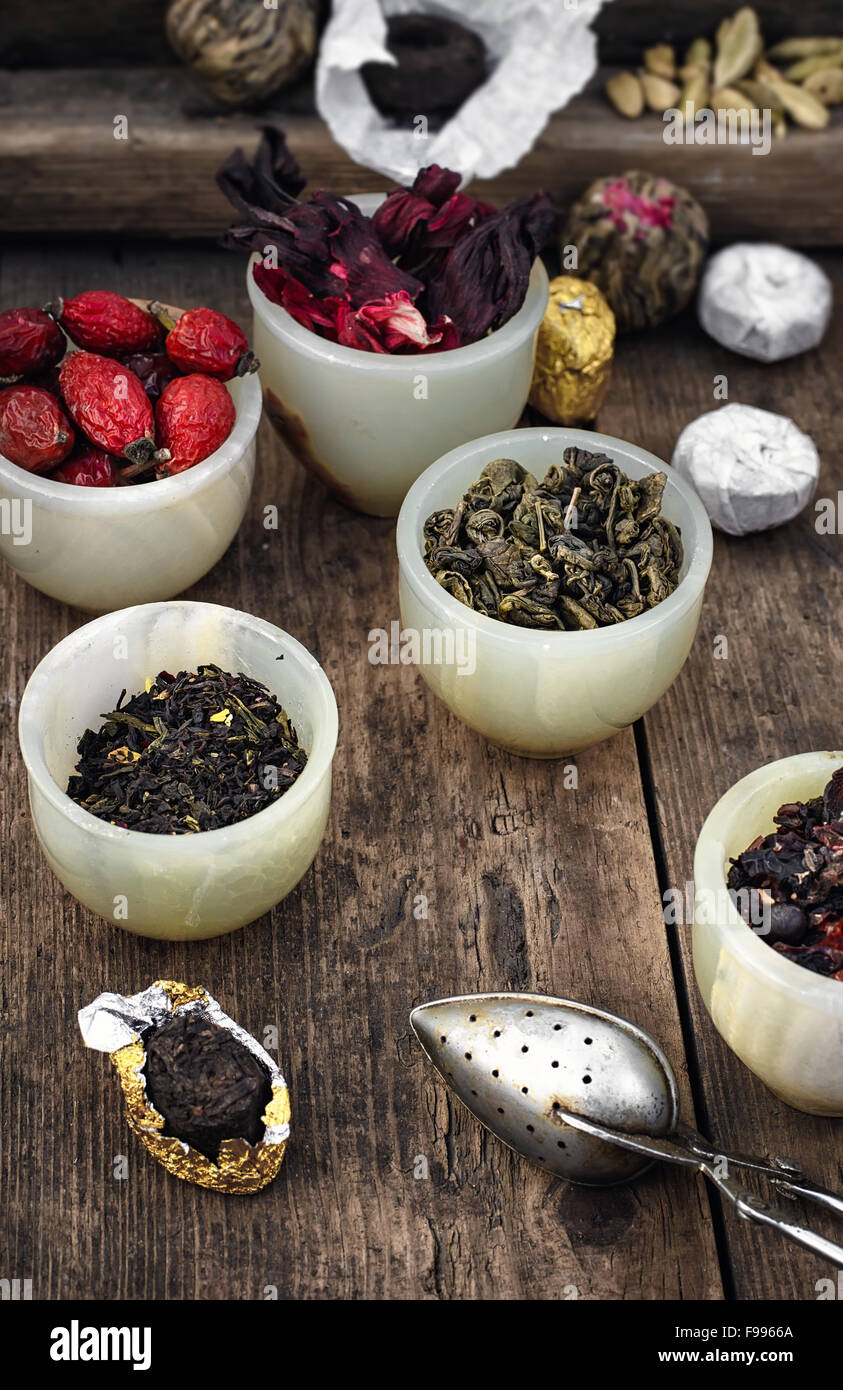 Different varieties of tea leaves in bowl of custard and spoon Stock ...