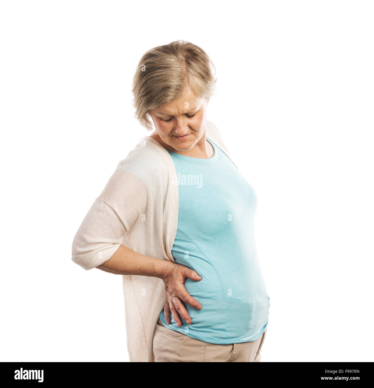 Senior woman with back pain, isolated on white background Stock Photo ...