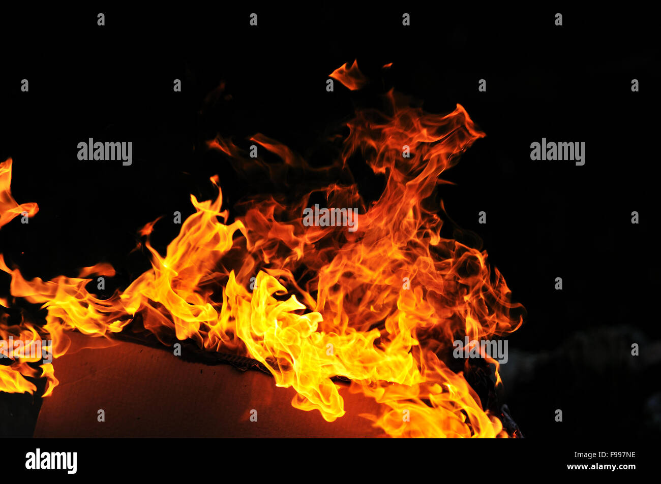 wild fire flames burn hot with black background Stock Photo - Alamy