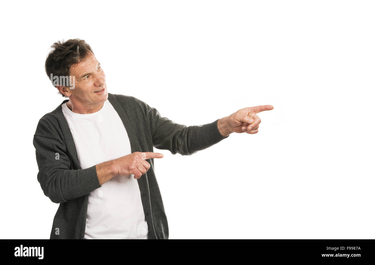 Portrait of a happy senior man pointing somewhere isolated on white ...