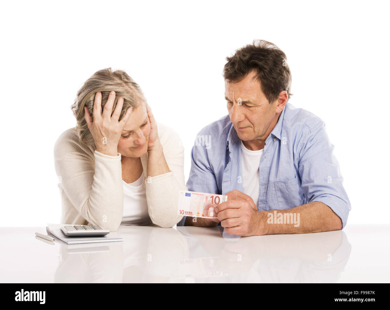 Senior couple with empty wallet discussing financial issues, isolated ...